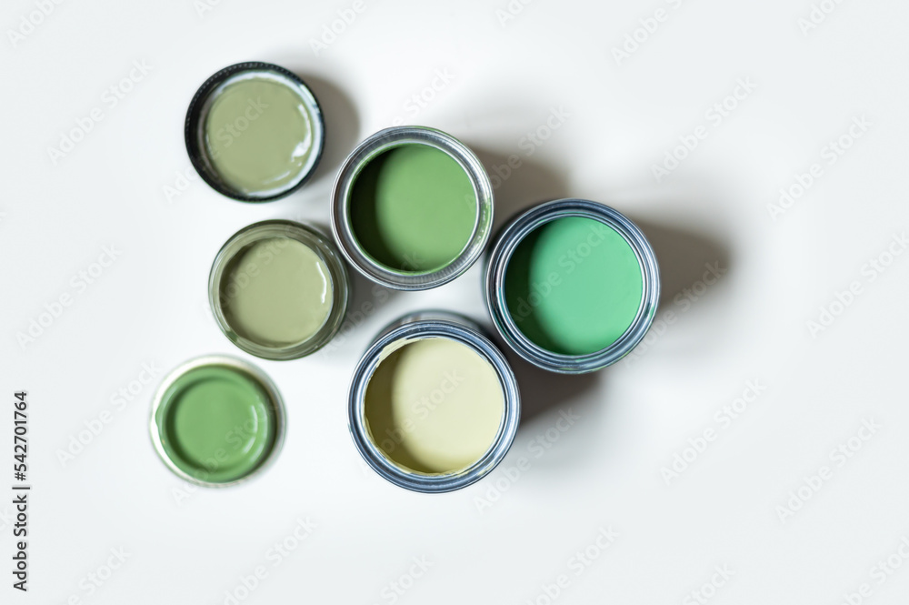 Tiny sample paint cans during house renovation, process of choosing ...