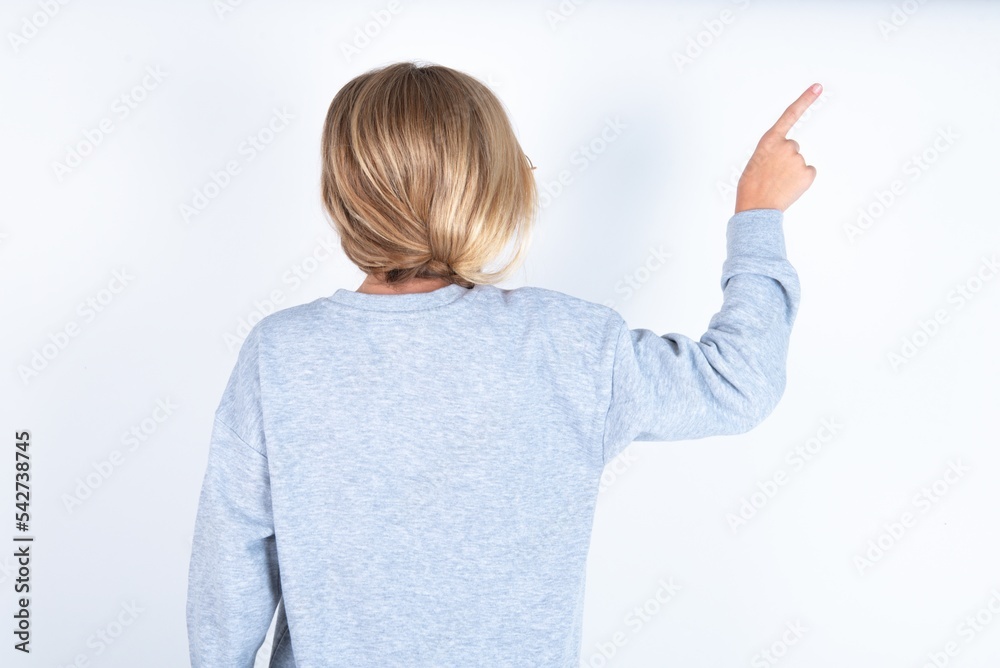 beautiful caucasian teen girl wearing gray sweater over white wall ...