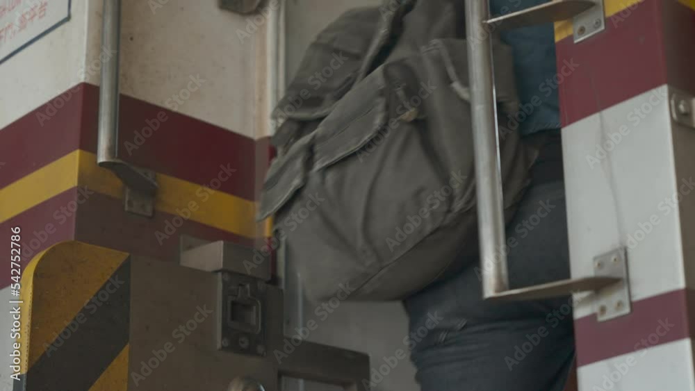 Close up asian man hands backpacker man wearing hat, jean jacket and ...