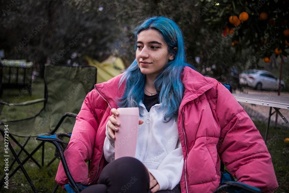 woman sitting peacefully at campsite, outdoor photos of marginal and ...