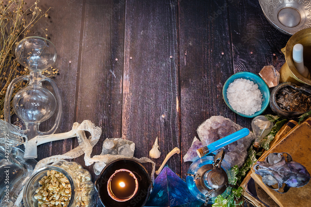Alchemical lab with pelican vessel. Cristals, ingridients, snake skin ...
