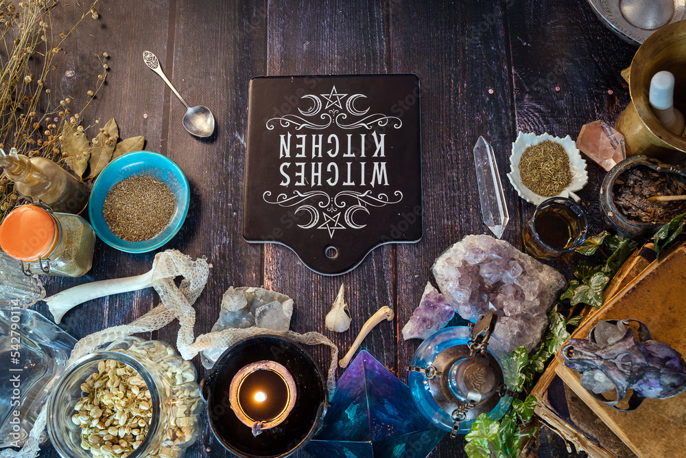 Occult altar with cristals, snake skin, potions, herbs, bones, skulls ...