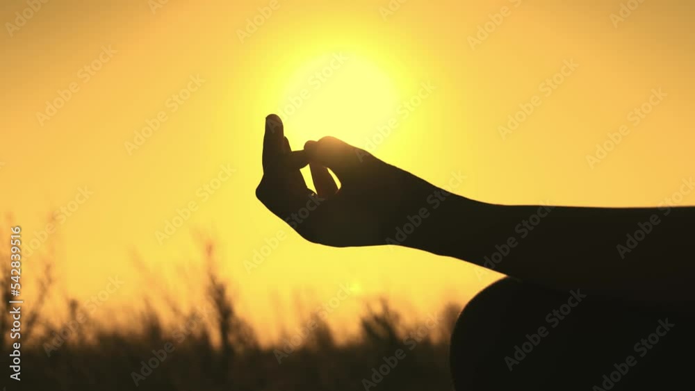 yoga hand sign. girl sunset doing yoga. female meditation glare sun ...