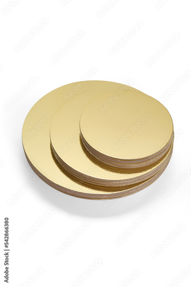 Close-up set of a gold paper cake boards with high-gloss finish. Rounds ...