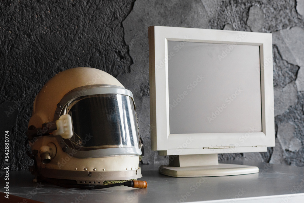 Concept of astronaut helmet and blank screen computer monitor with copy ...