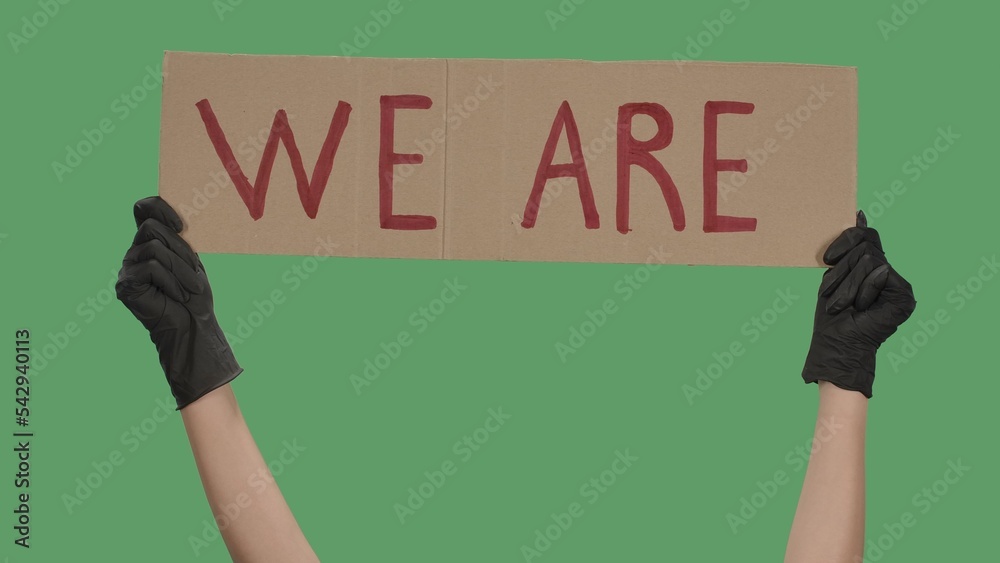 WE ARE. Protest text message on cardboard. Stop racism. Police violence ...