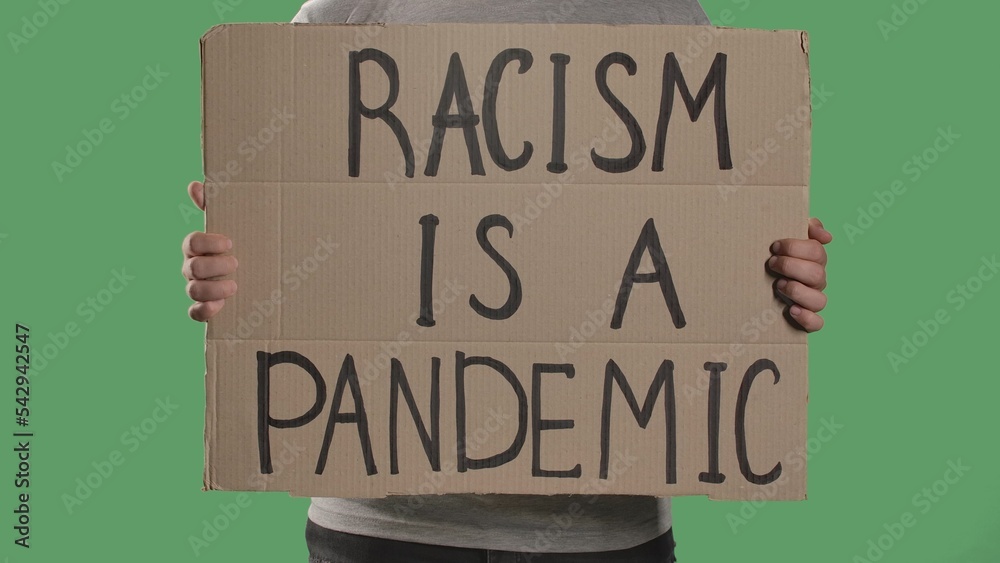 Foto de Man holds in front of him a poster from a cardboard box with ...