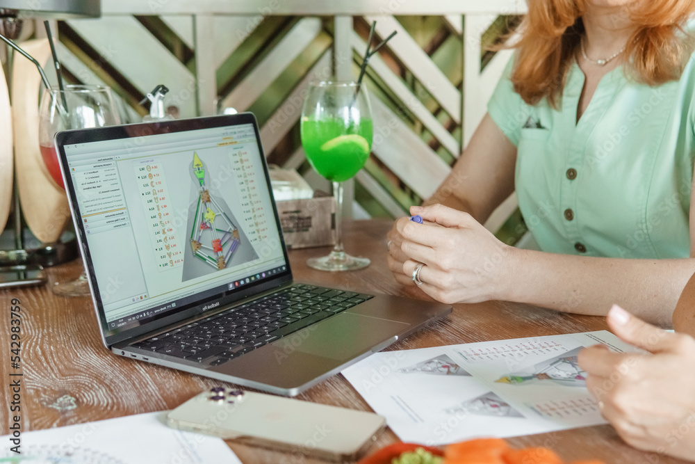 Tver, Russia-august 7, 2022. A woman with a laptop is studying human design. The concept of ...