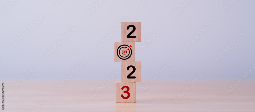 Icon of a goal or target in 2023 on a cube of wood. Plans for the ...