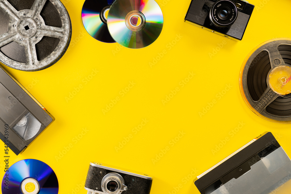 Shiny rainbow CD or DVD compact discs, audio or video filmstrip bobbin ...