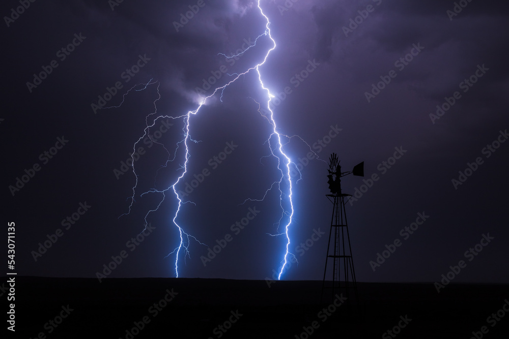 Lightning bolt strike and windmill silhouette in a thunderstorm Stock ...