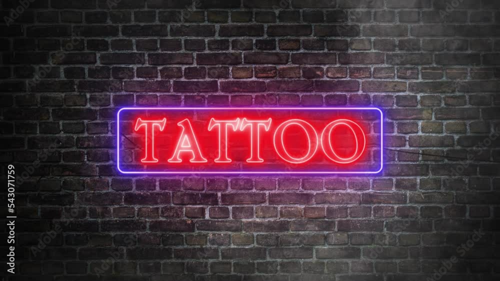 Tattoo shop neon real signboard on bricks wall background. Blue frame ...