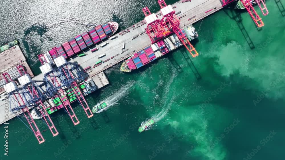 Cargo Container Ship Load Container Box under crane at bridge port ...