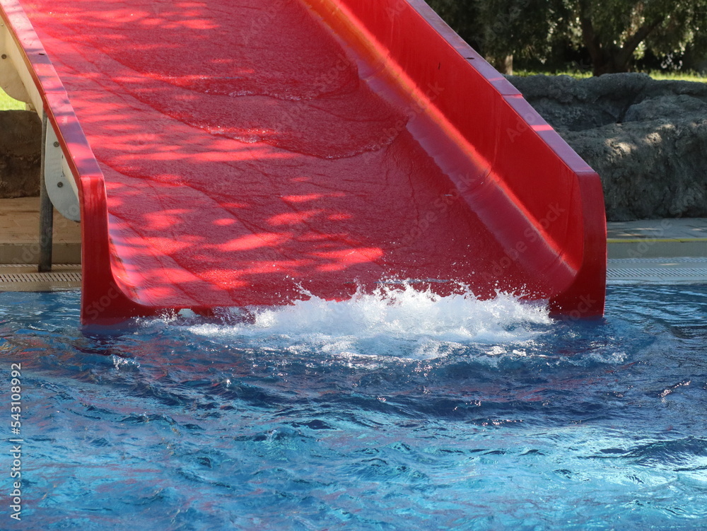 Water slide with flowing water Stock Photo | Adobe Stock