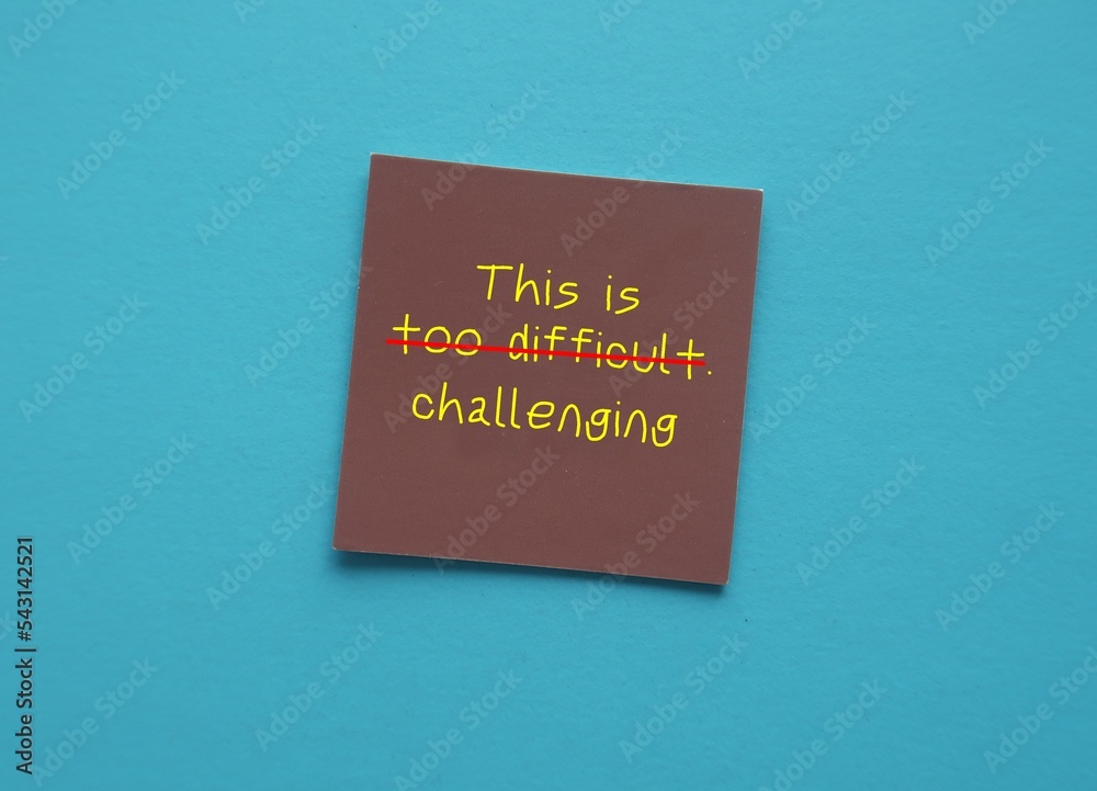 Brown card on blue background with handwriting THIS IS TOO DIFFICULT ...