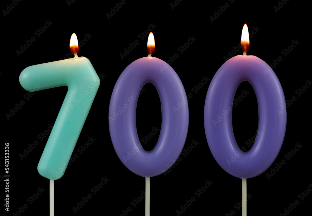 Colorful birthday candles isolated on black background, numbers 700 ...