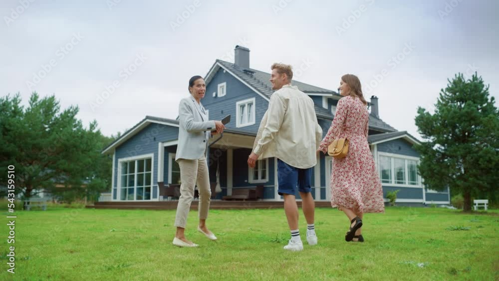 Young Couple Visiting a Potential New Home Property with Professional ...
