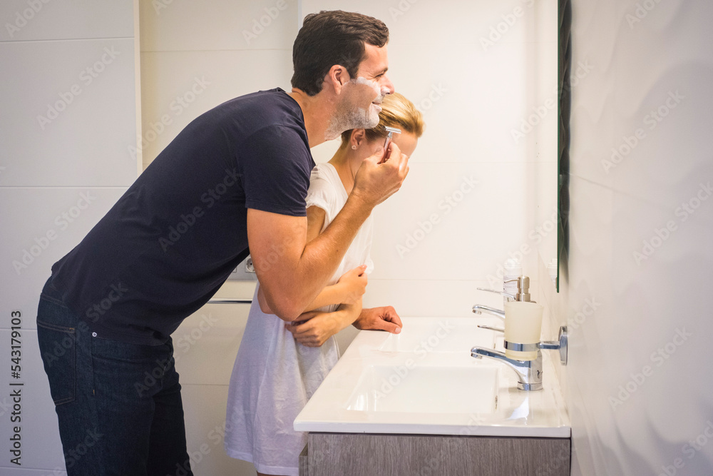 Young couple enjoy leisure activity at home together in the bathroom ...