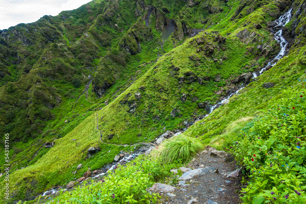 Beautiful mountains peaks and waterfalls in the background. Shrikhand ...