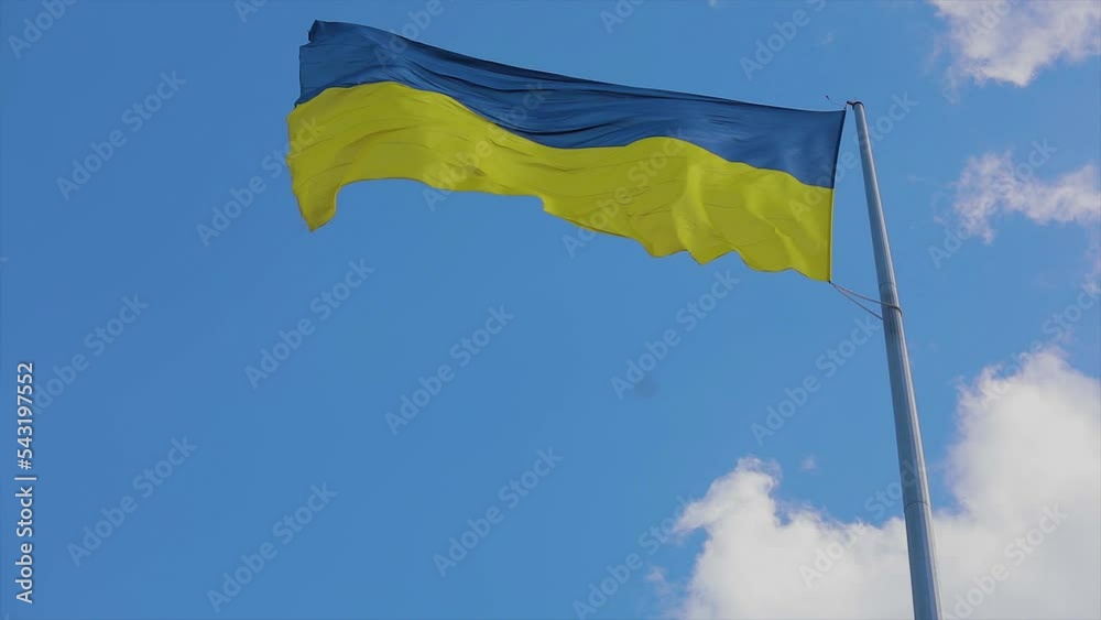 Ukrainian flan in the wind. The flag of Ukraine flutters in the wind ...