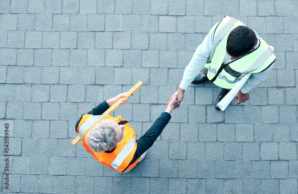 Builder, construction worker and architect handshake with aerial view ...