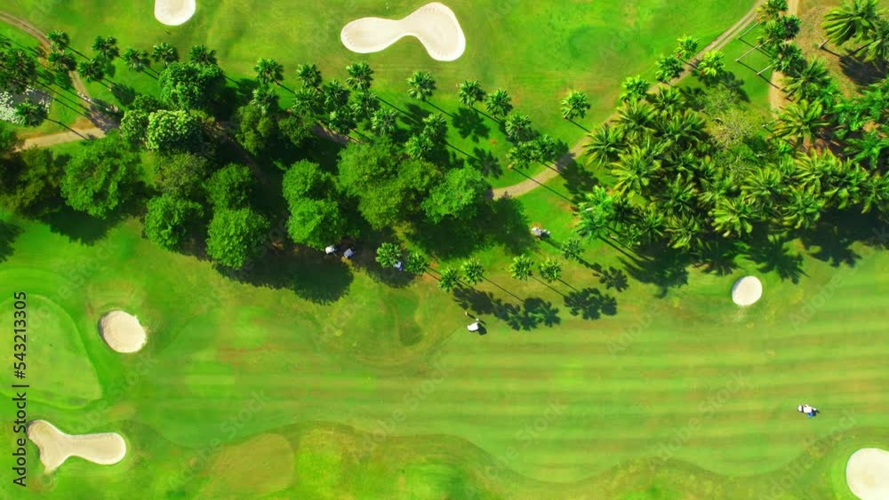 Aerial view over golf field landscape during sunrise. Hobby and sports ...