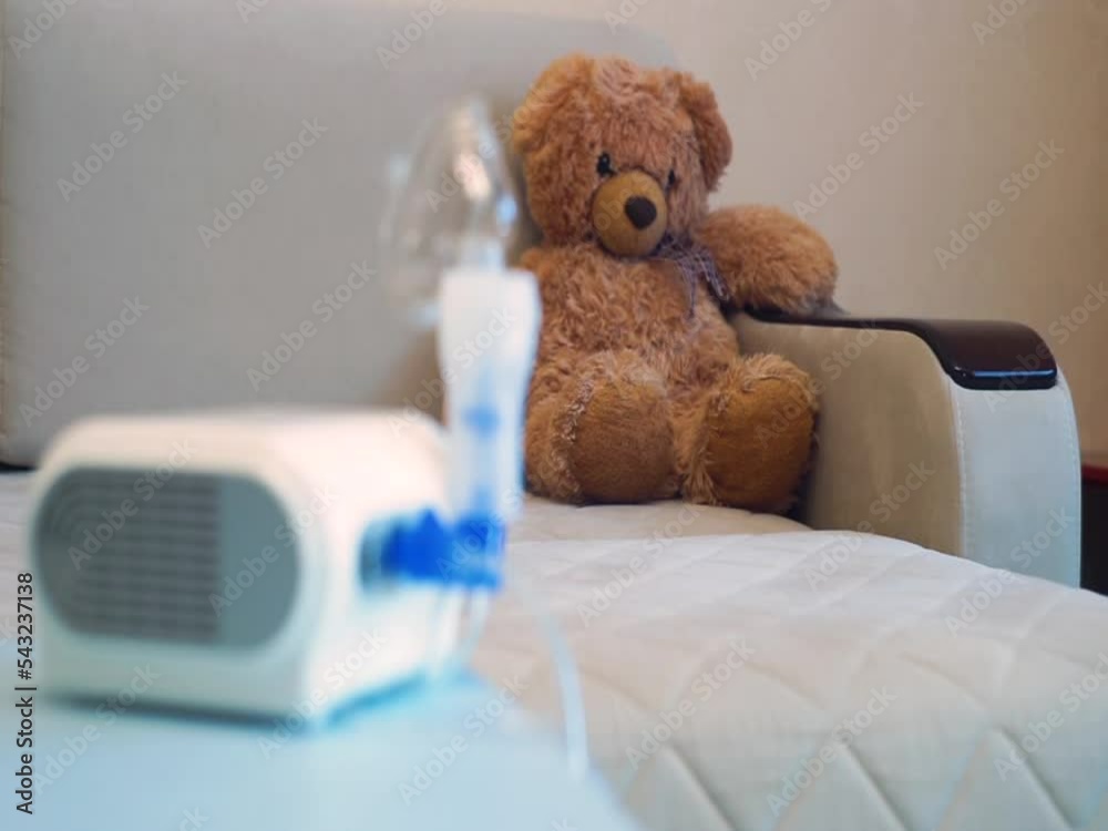 The device for inhalation of the child. A teddy bear toy and an asthma ...