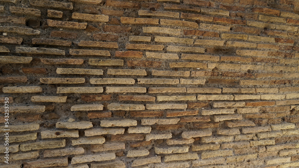 Detail of a wall in Roman structure made of bricks and with the opus ...