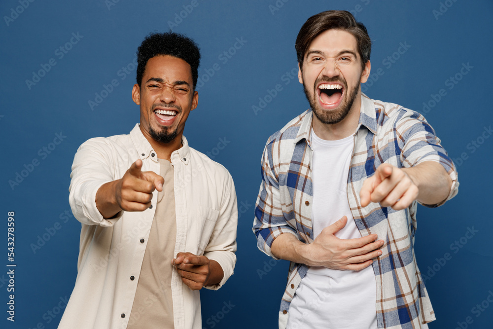 Young two friend men 20s wear white casual shirts together point finger ...