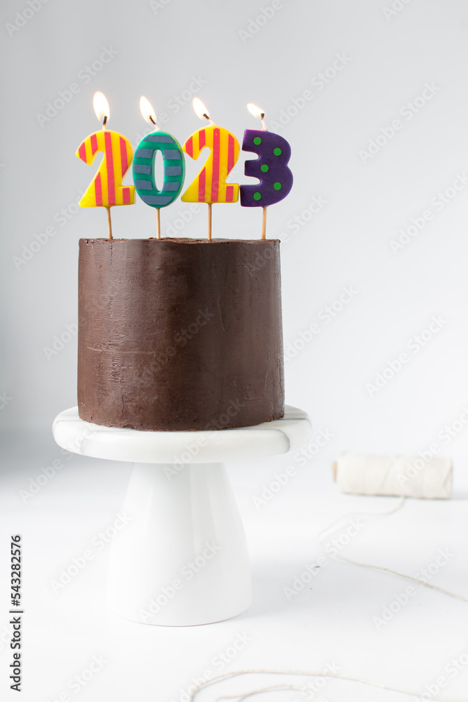 2023 cake, new year cake, chocolate ganache cake on a cake stand Stock ...