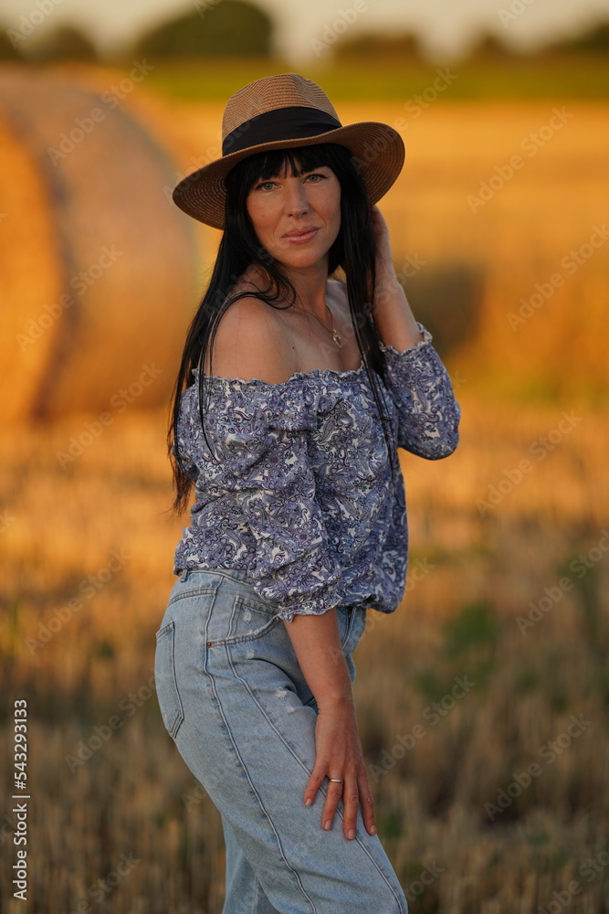 Portrait of a happy Ukrainian girl in nature during the harvest ...