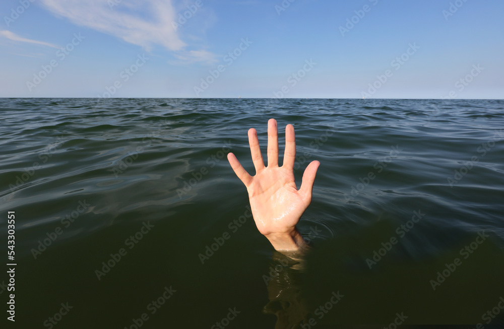 hand on the sea of a person who is drowning and seeks help Stock Photo ...