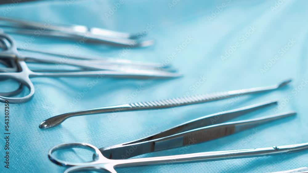 The nurse prepares medical devices, scalpels, forceps and others ...