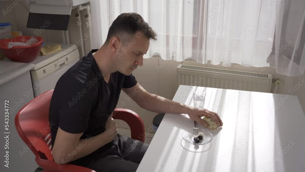 Hungry and sad man can't get enough. The global food crisis. As a ...