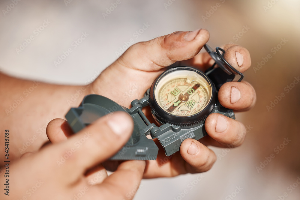 Hiking man, hands or pocket compass in travel location, camping ground ...