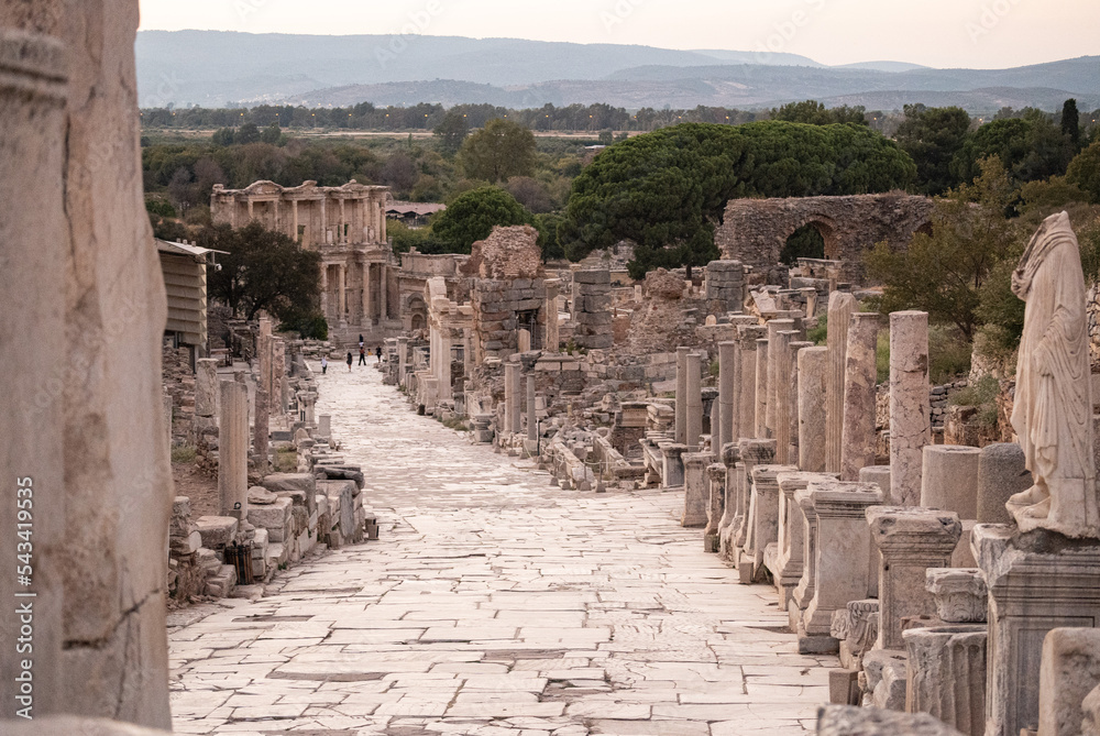 Big ancient stone pathway with columns and ruins around leading to the ...