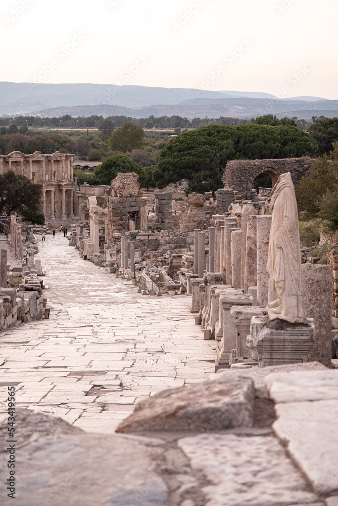 Big ancient stone pathway with columns and ruins around leading to the ...
