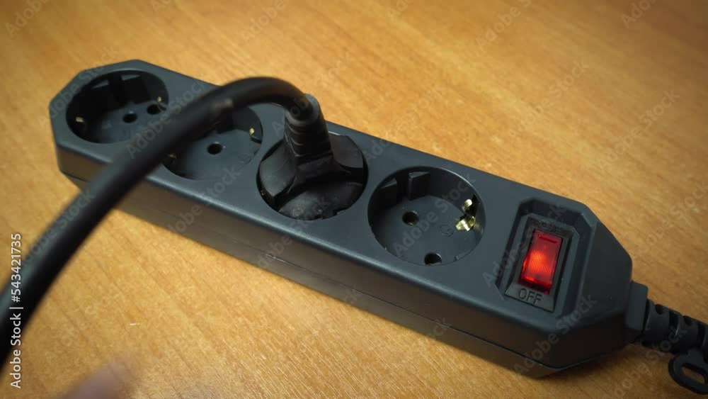 Insert plug into extension cord socket by pressing red push button ...