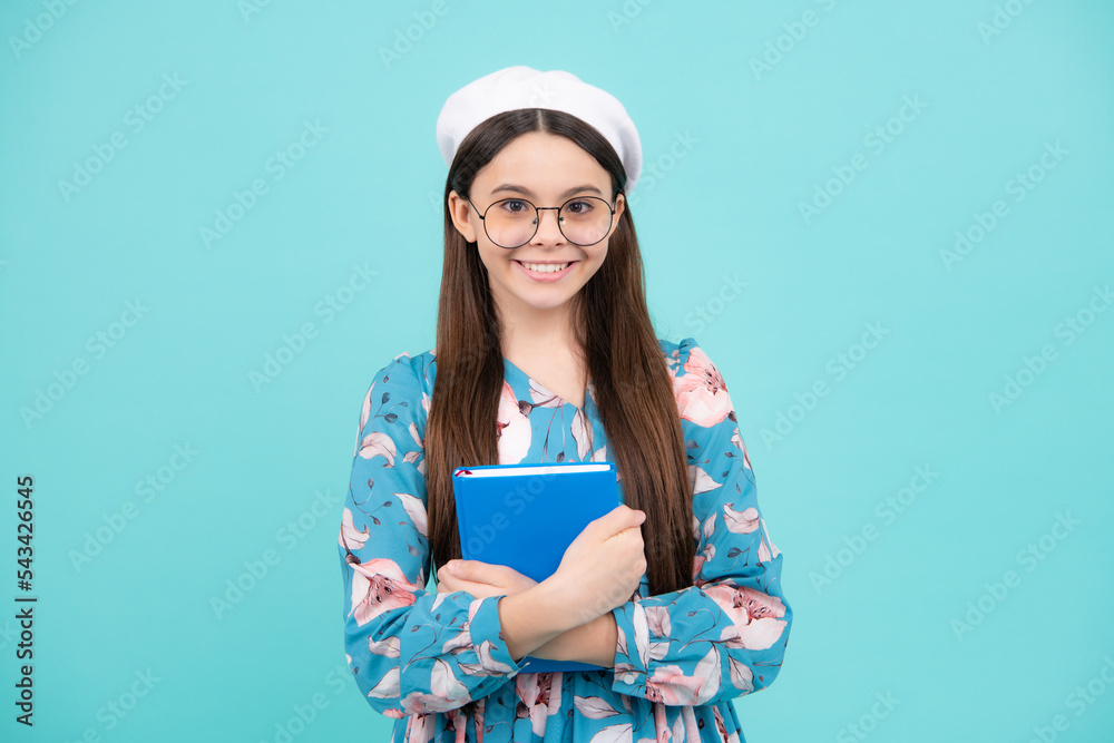 Schoolgirl with copy book posing on isolated background. Literature ...