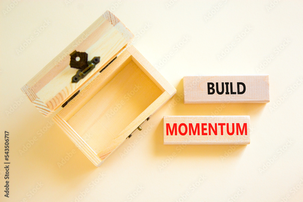 Build momentum symbol. Concept words Build momentum on wooden blocks ...