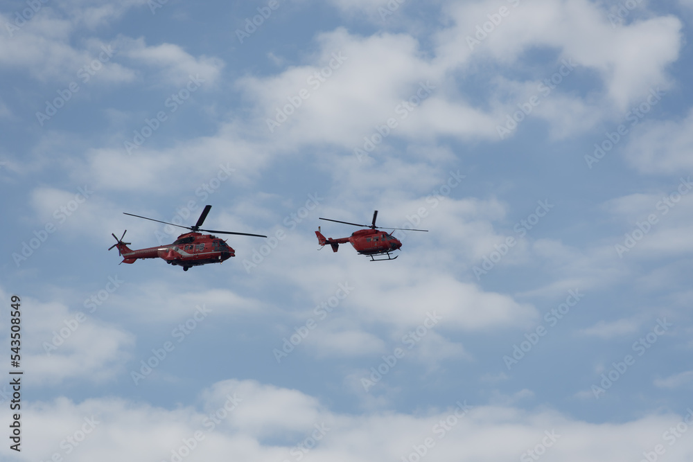 Greek firefighting helicopters demonstrating flight air show. An ...