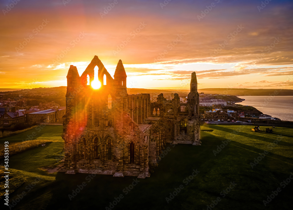 Sunset view of Whitby abbey overlooking the North Sea on the East Cliff ...
