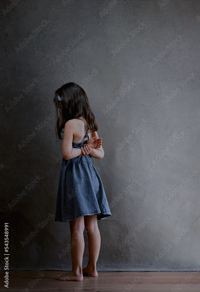 punished girl stands in the corner and is offended by the whole world ...