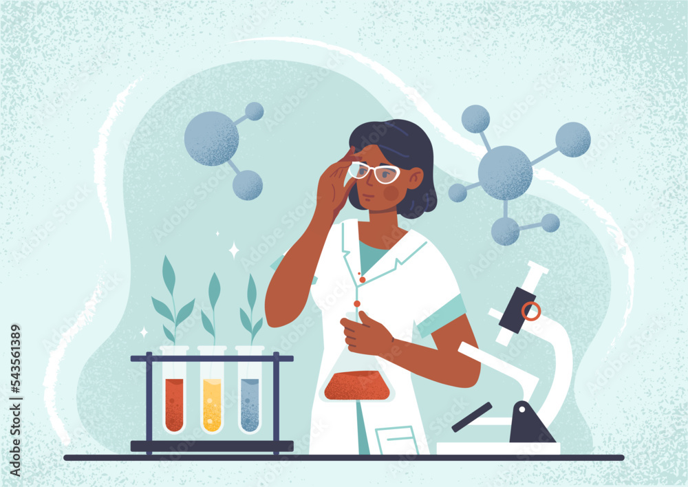 Biologist at workplace. Young girl stands near test tubes and ...