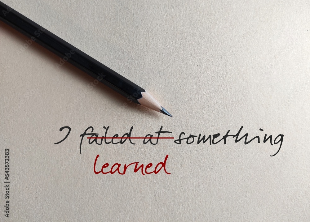 Pencil on beige background with handwritten text I FAILED AT SOMETHING ...
