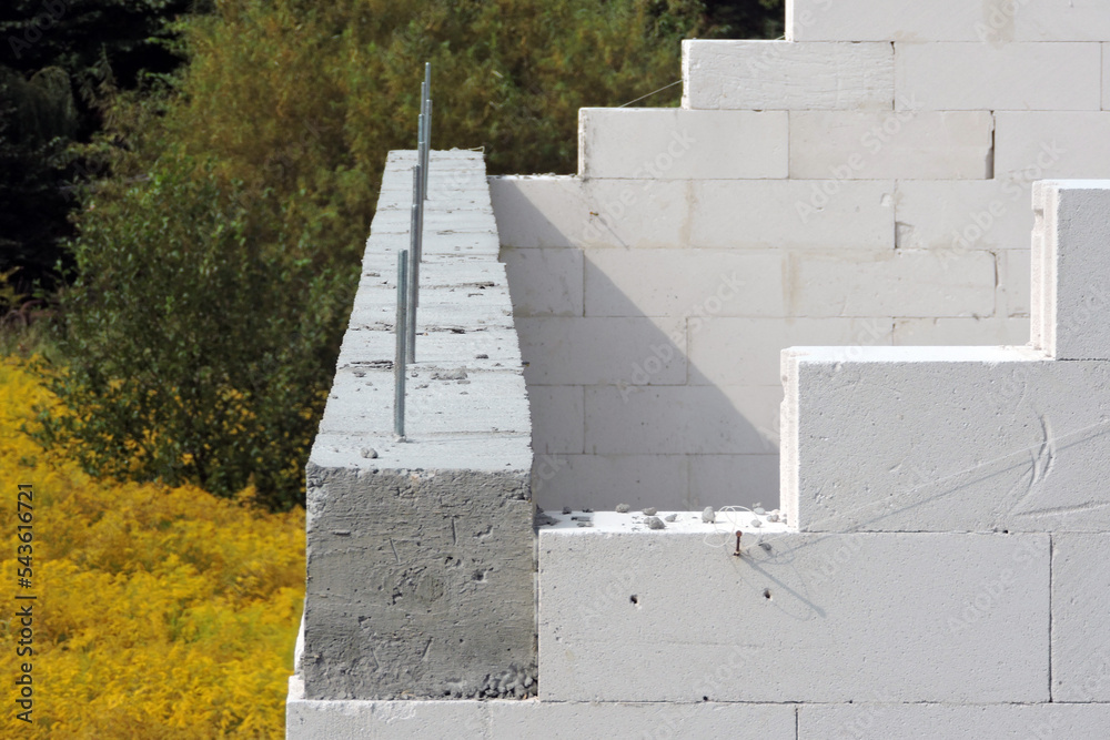 Construction steel pins, a reinforced concrete beam and steel bars on ...