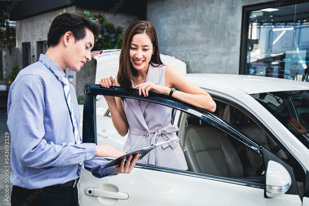 Beautiful Asian customer brought the car to check the condition of the ...