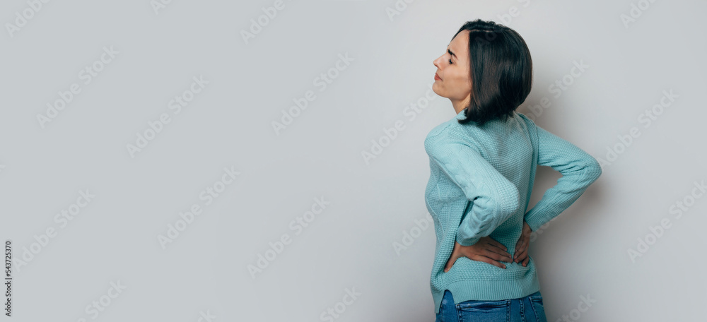 Spinal cord problems on woman's back. Chronic back pain. Young brunette ...