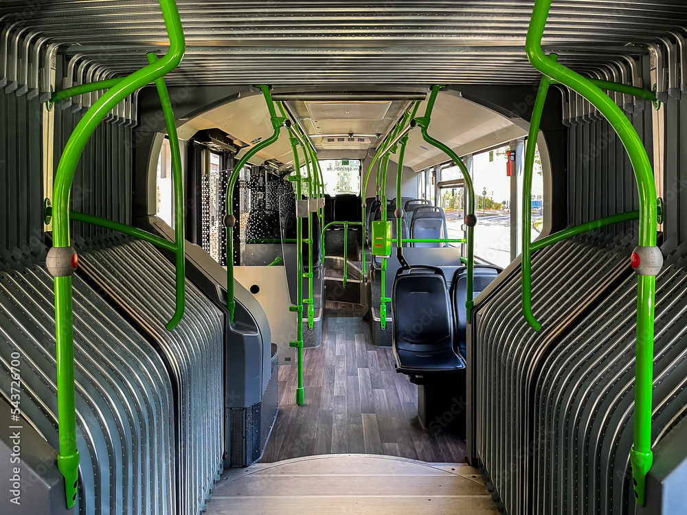 Interior of a modern public bus with swivel joint. Public transport ...