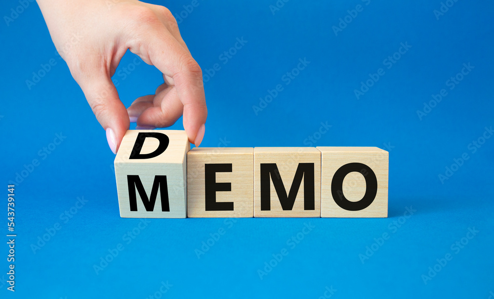 Demo and Memo symbol. Businessman hand turns wooden cube and changes ...